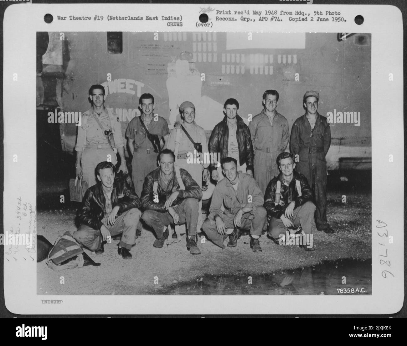 Lt. Loy and crew of the 394th Bomb Squadron, 5th Bomb Group pose beside ...