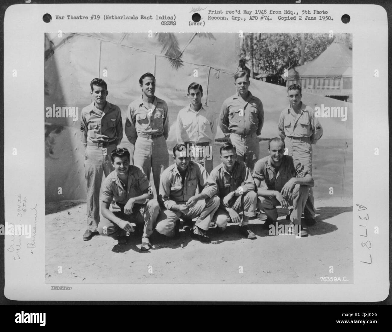 Lt. Loy and crew of the 394th Bomb Squadron, 5th Bomb Group pose beside ...