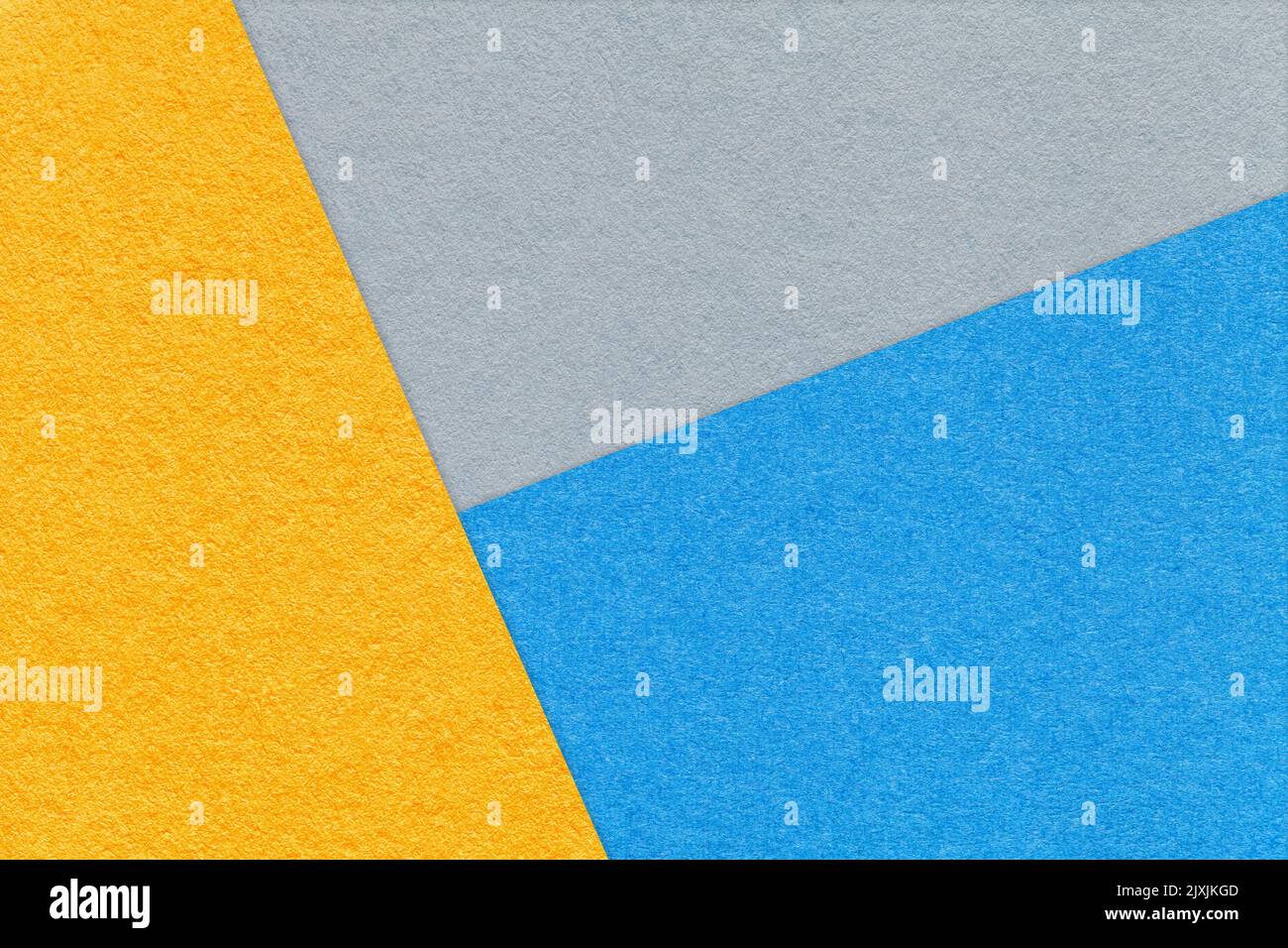 Texture of craft yellow, blue and gray shade color paper background ...
