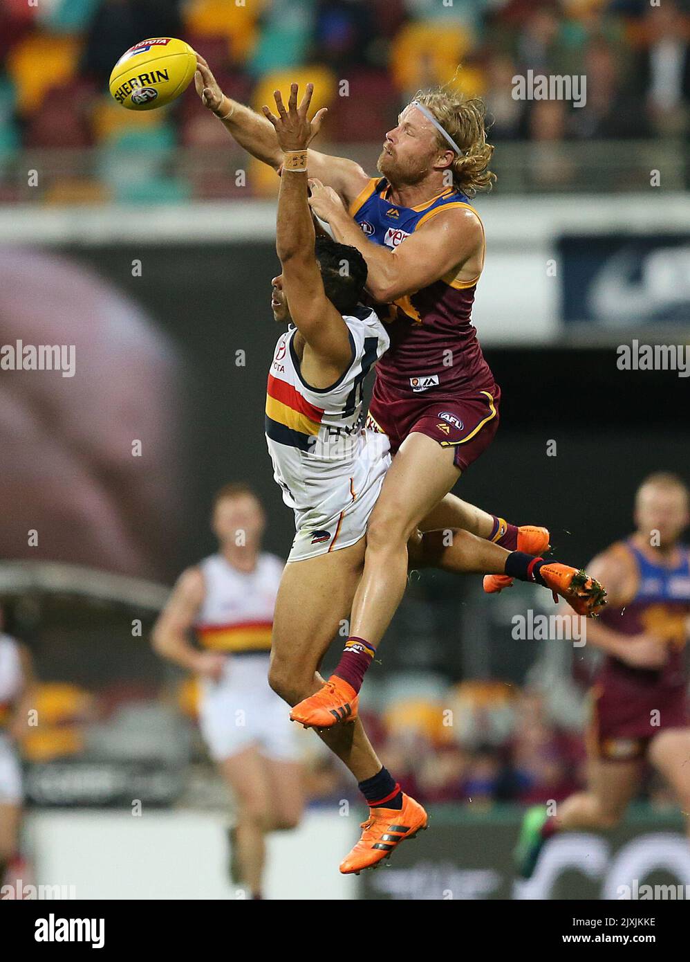 Wayne Milera of the Crows competes with Daniel Rich of the Lions during ...