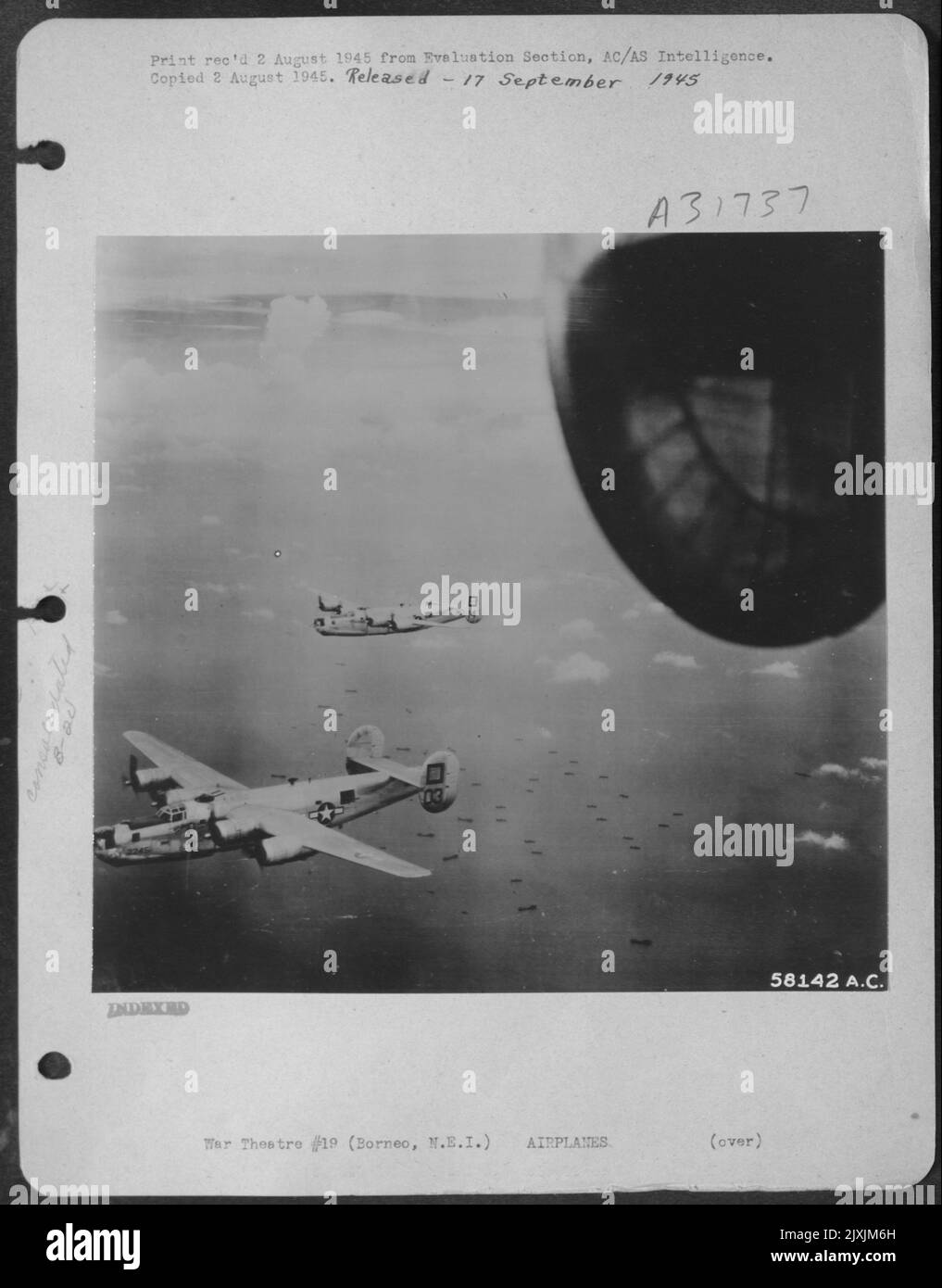 Consolidated B-24 Liberators pass over Allied invasion fleet off the ...
