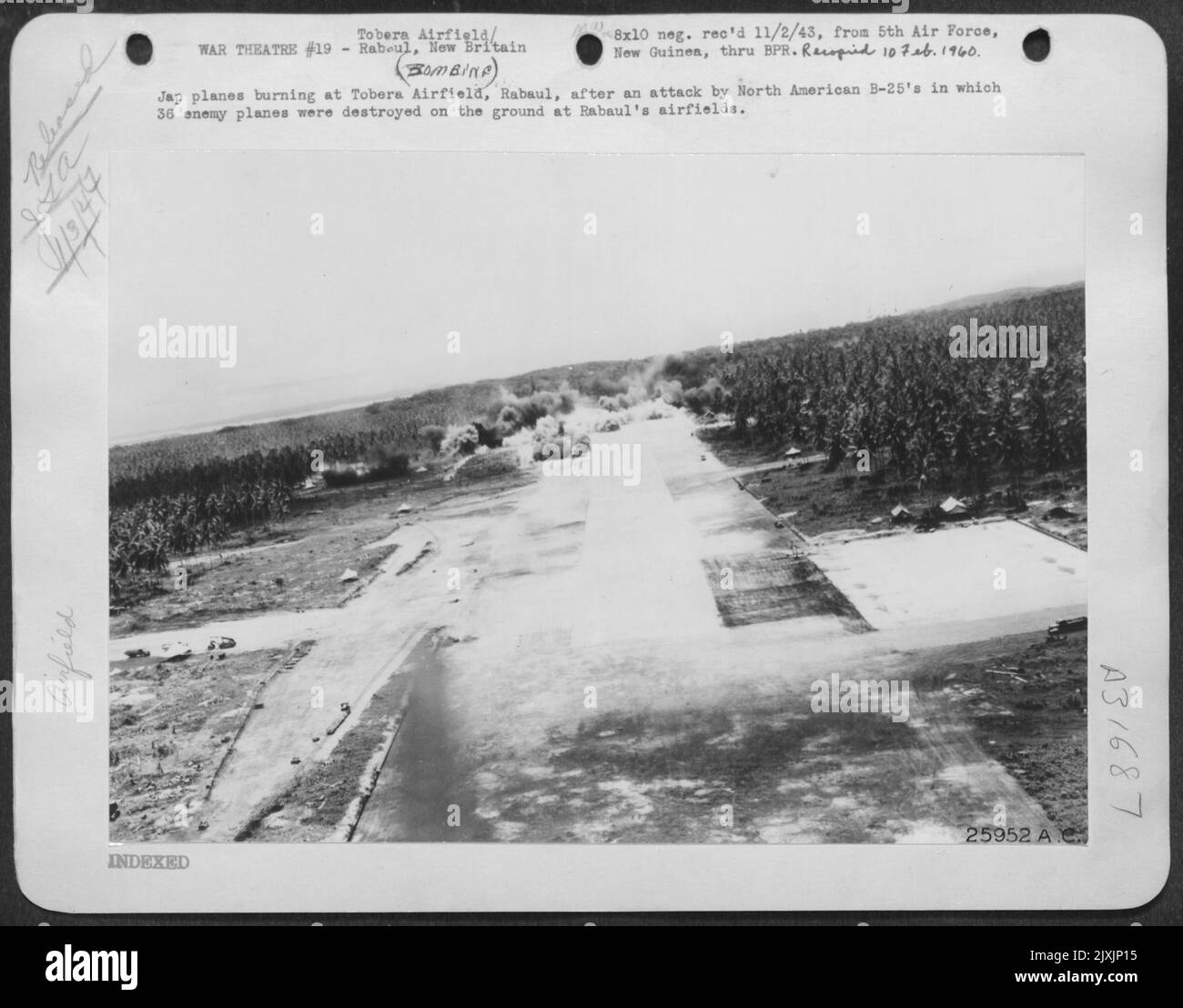 Japanese planes burning at Tobera Airfield, Rabaul, after an attack by ...