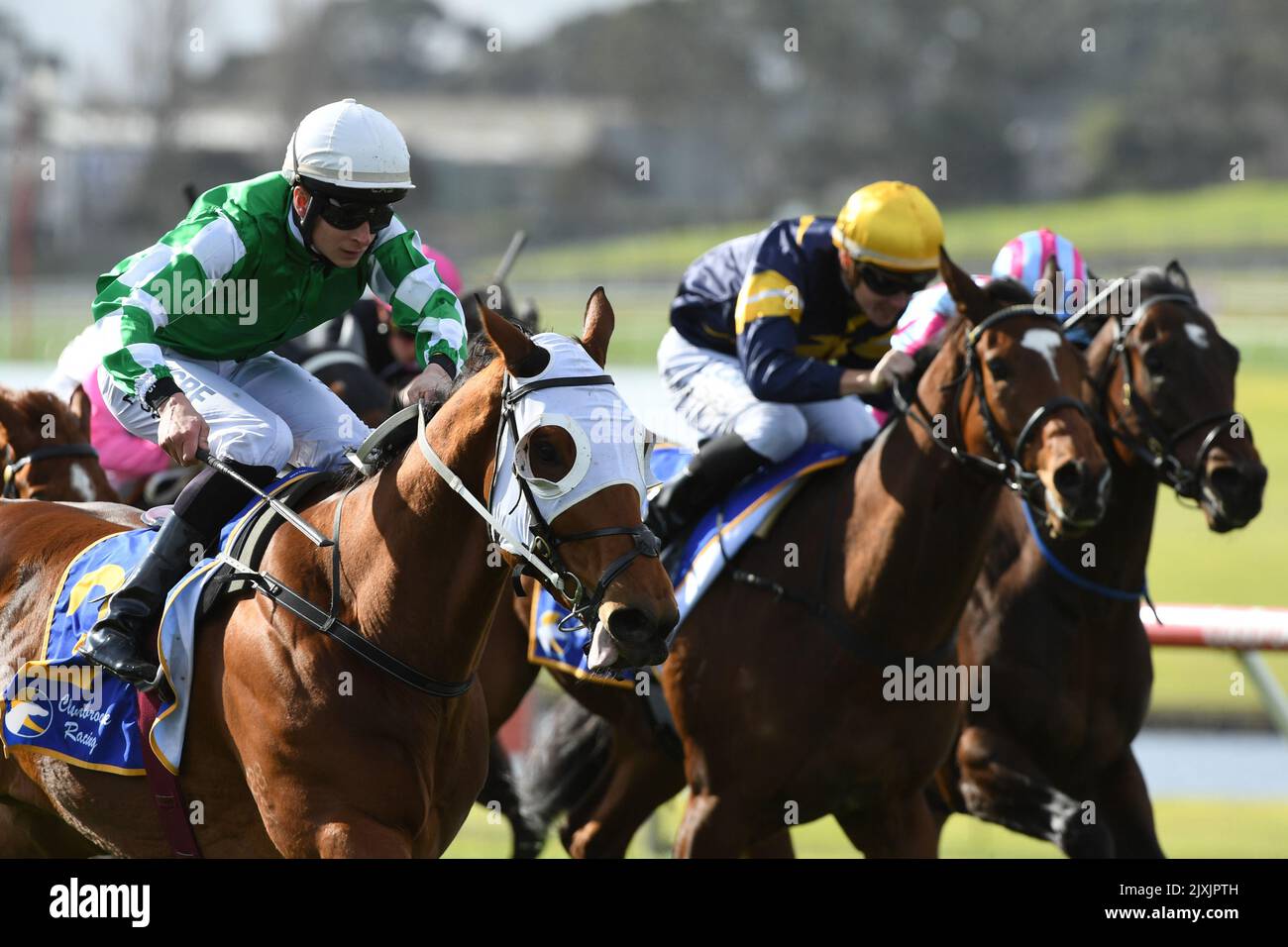 Jockey Zac Spain (left) rides Holy Command to victory in race 4, the ...