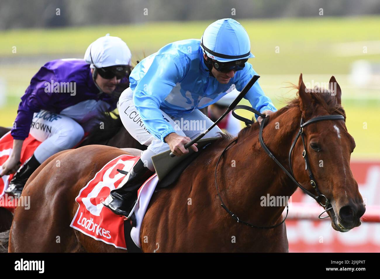 Jockey Luke Currie (right) rides Illumicon to victory in race 5, the ...