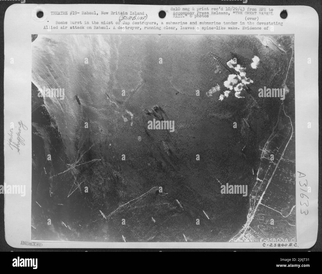 Bombs burst in the midst of Japanese destroyers, a submarine and ...