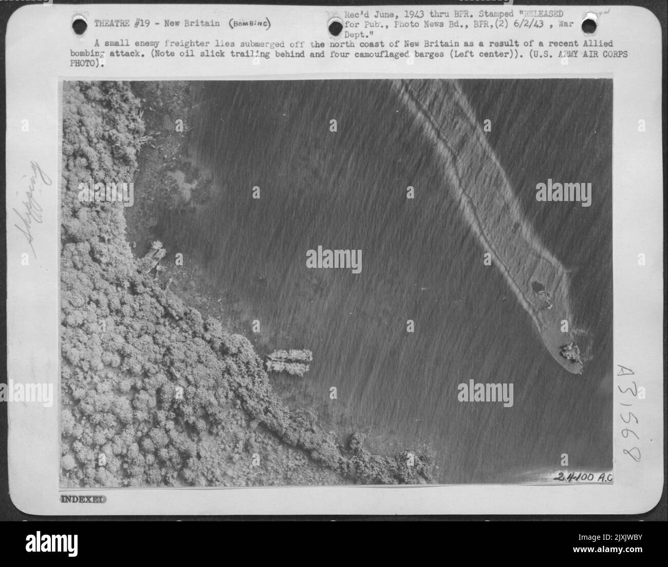 A small enemy freighter lies submerged off the north coast of New ...