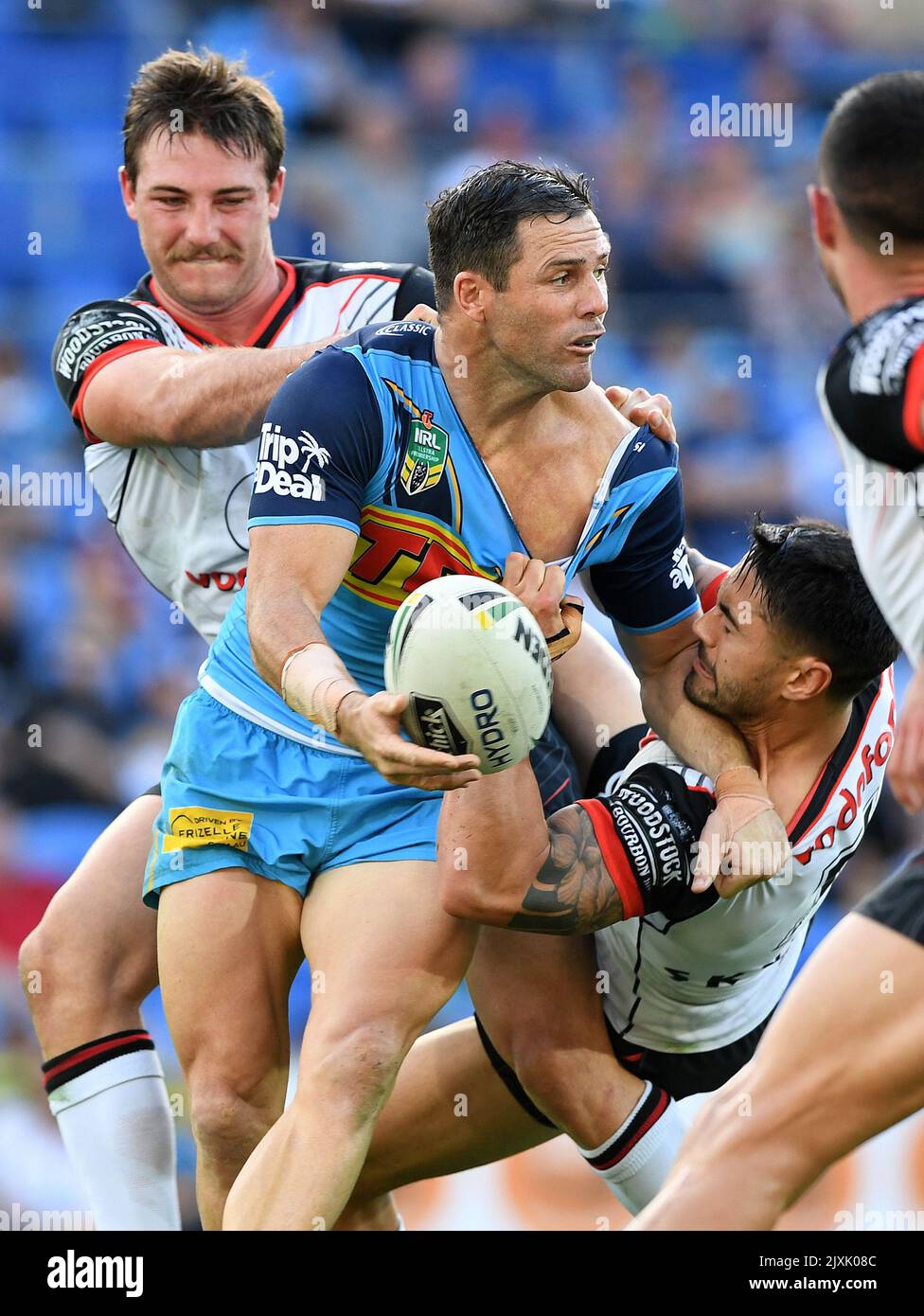 Michael Gordon of the Titans offloads during the Round 20 NRL match ...