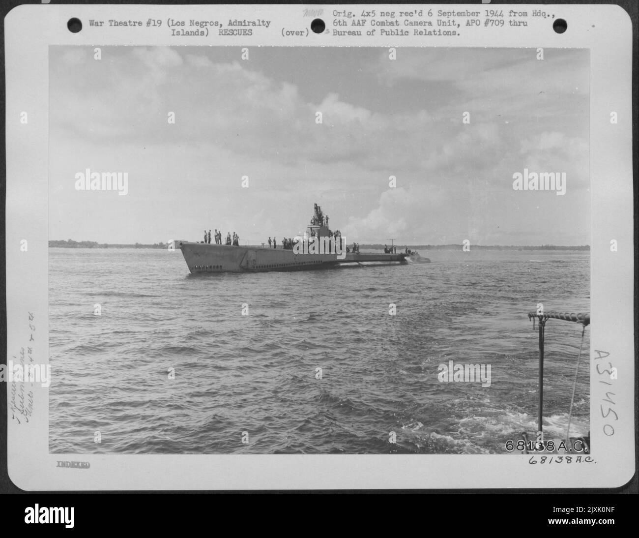 The submarine, USS Guivana, carrying the rescued flyers of the 394th ...