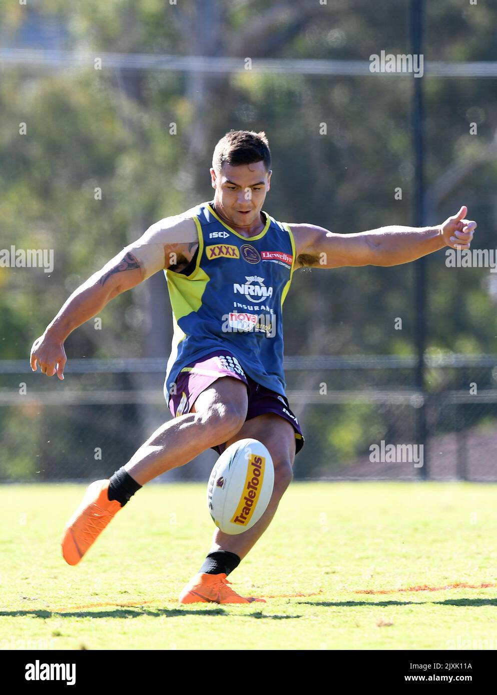 Kodi Nikorima kicks during the Brisbane Broncos training session in ...