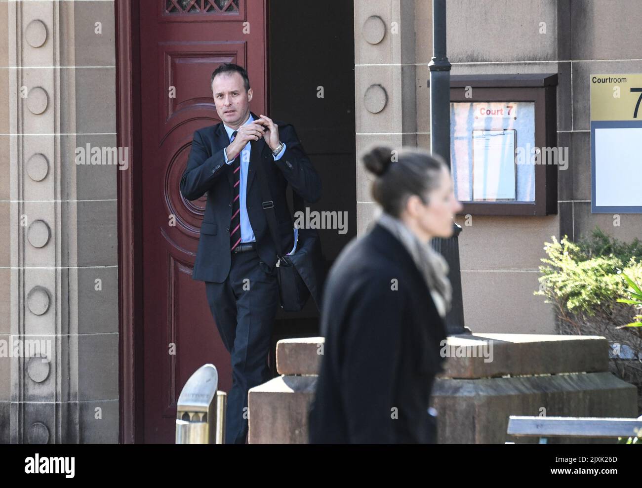 Forensic psychiatrist Dr Adam Martin (left) leaves the Darlinghurst ...