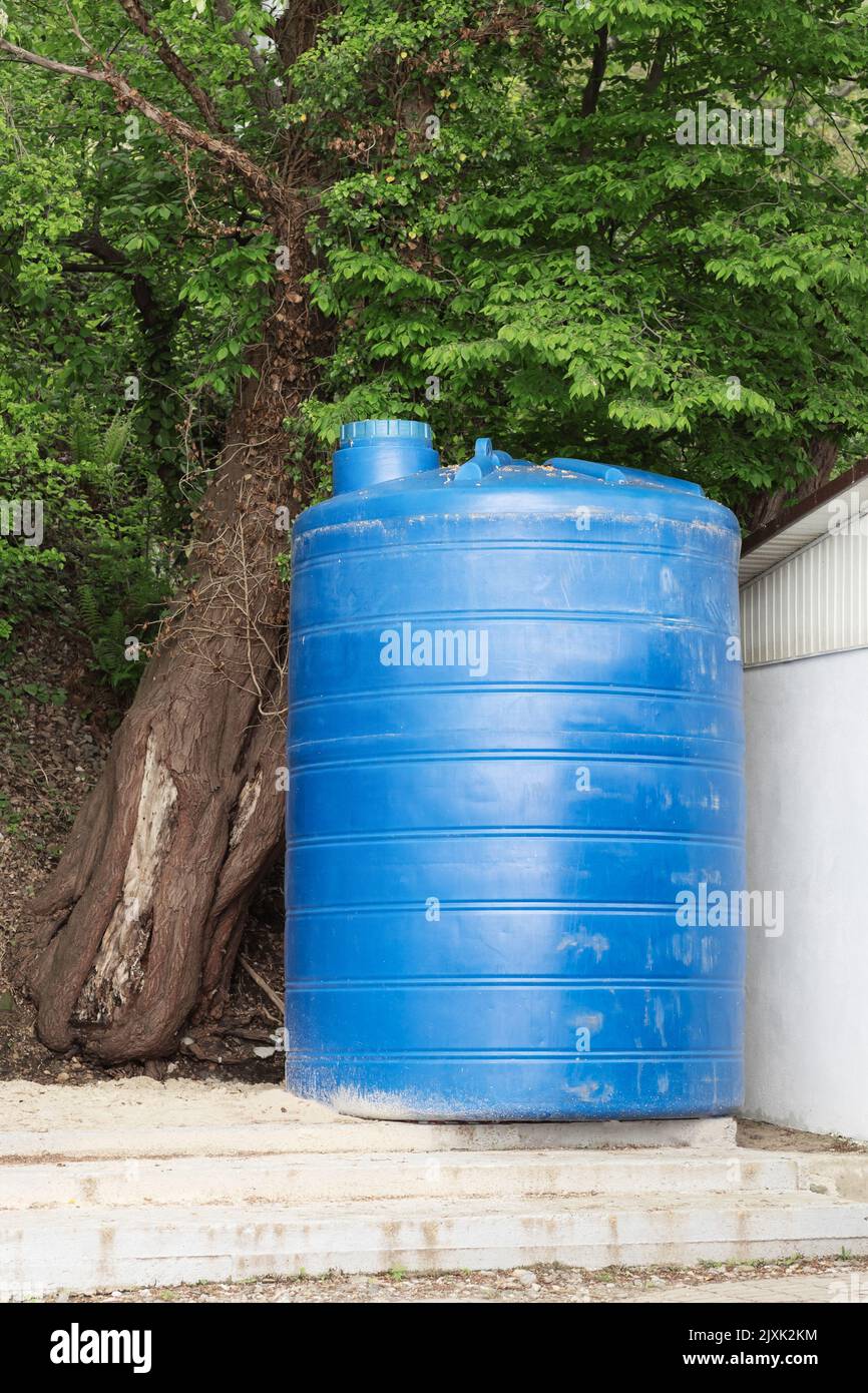 Large blue plastic water tank. Water storage vessel for garden Stock ...