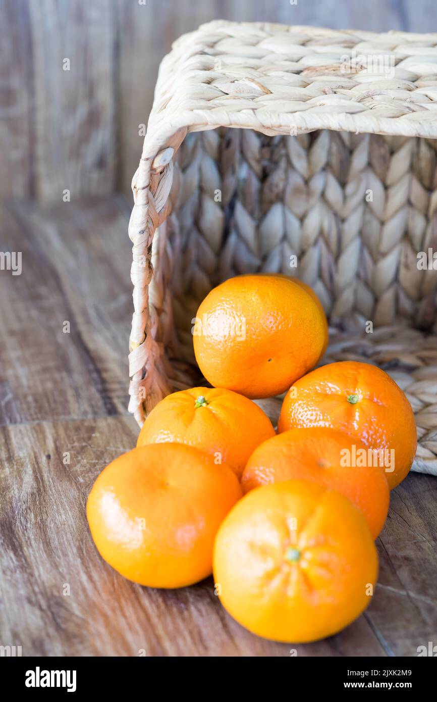 Citrus organic orange tangerine fruits in a basket Stock Photo - Alamy