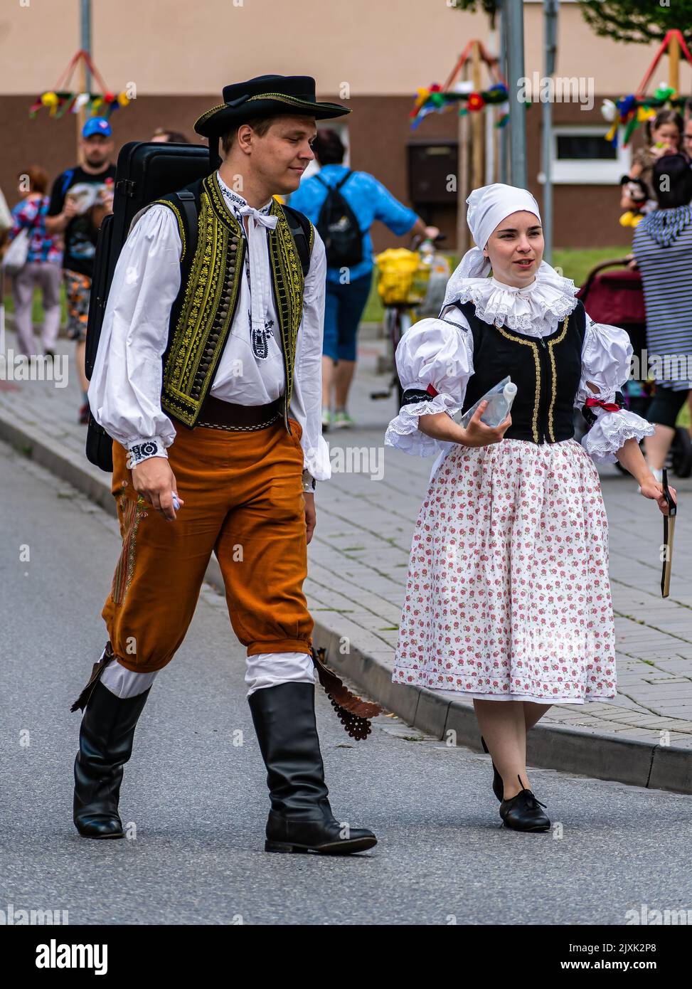 A vertical shot of people in costumes at the international Folklore ...