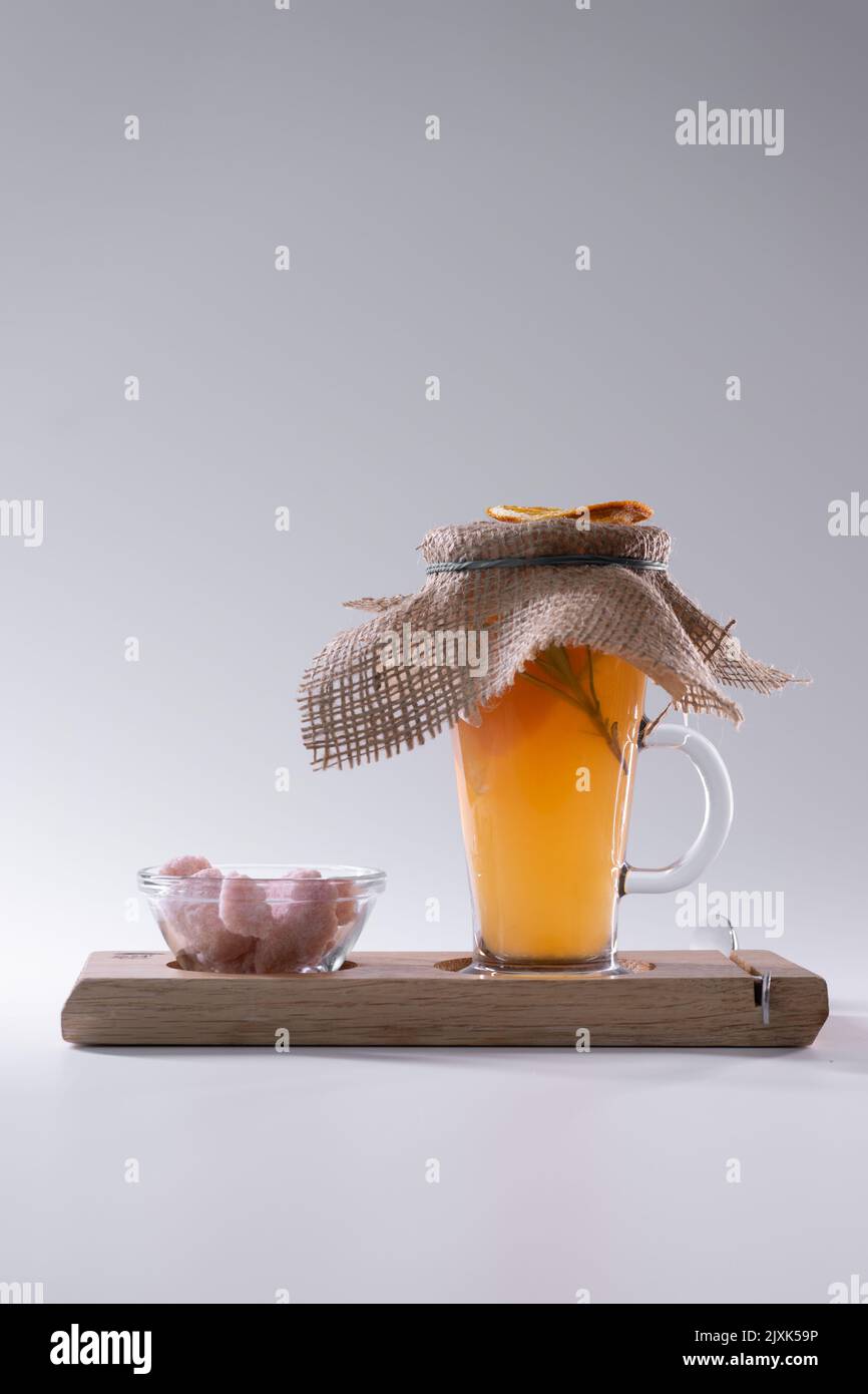 hot fresh orange vitamin grapefruit and rozemary tea cup and pink sugar ...