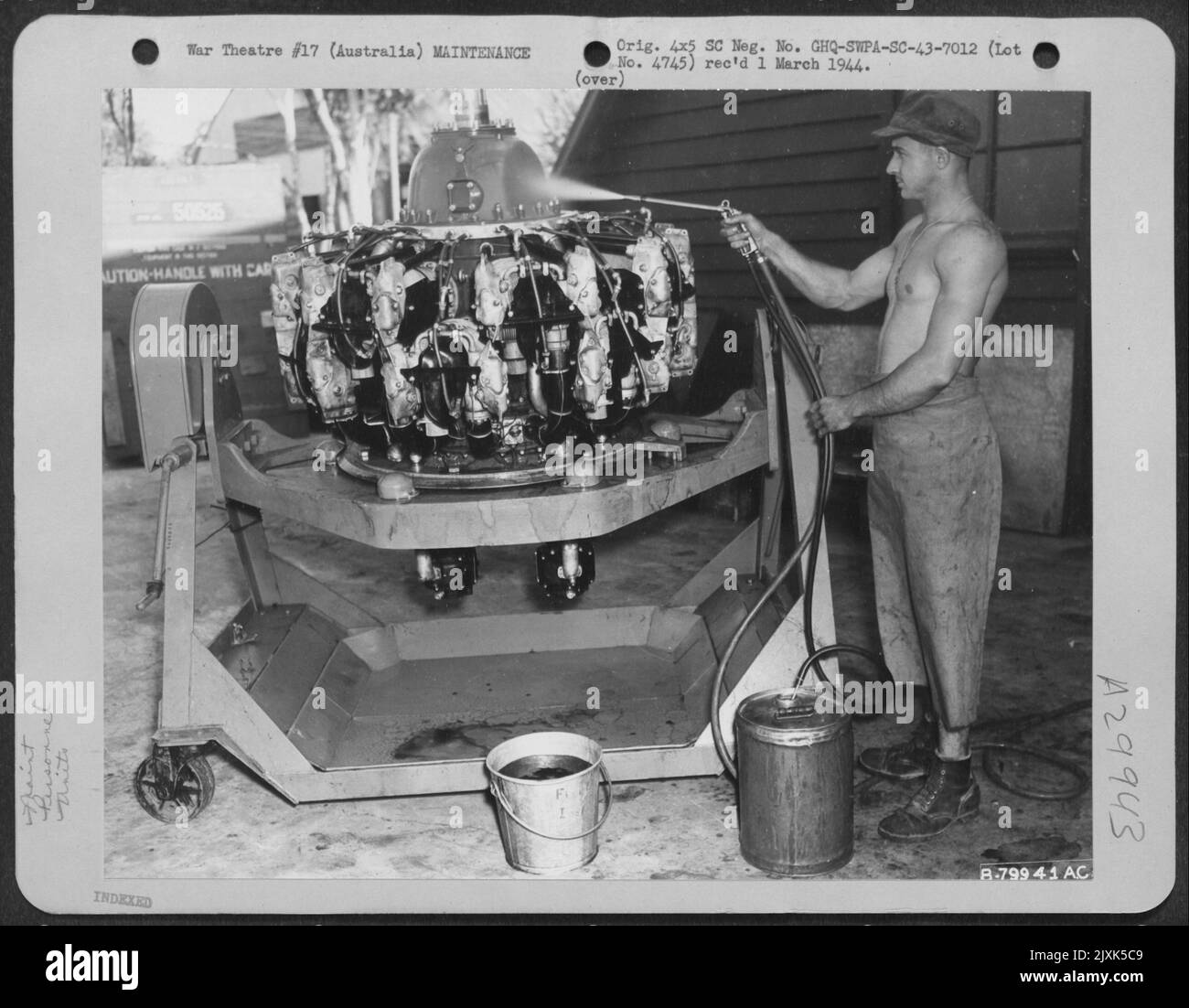 Pvt. John A. Luster of Chicago, Illinois operates a gasoline spray gun ...