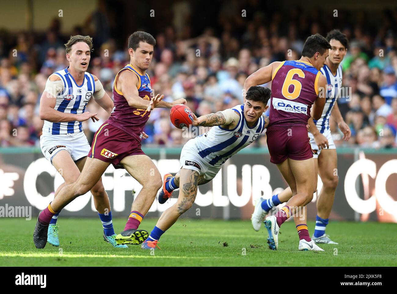 Brandon Starcevich of the Lions (2nd left) kicks to goal during the ...