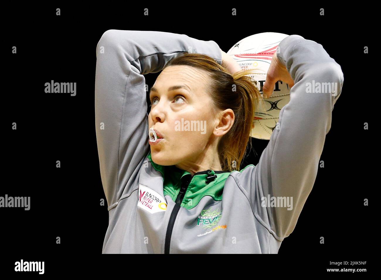 Natalie Medhurst of the Fever warms up prior to the Round 14 Super ...