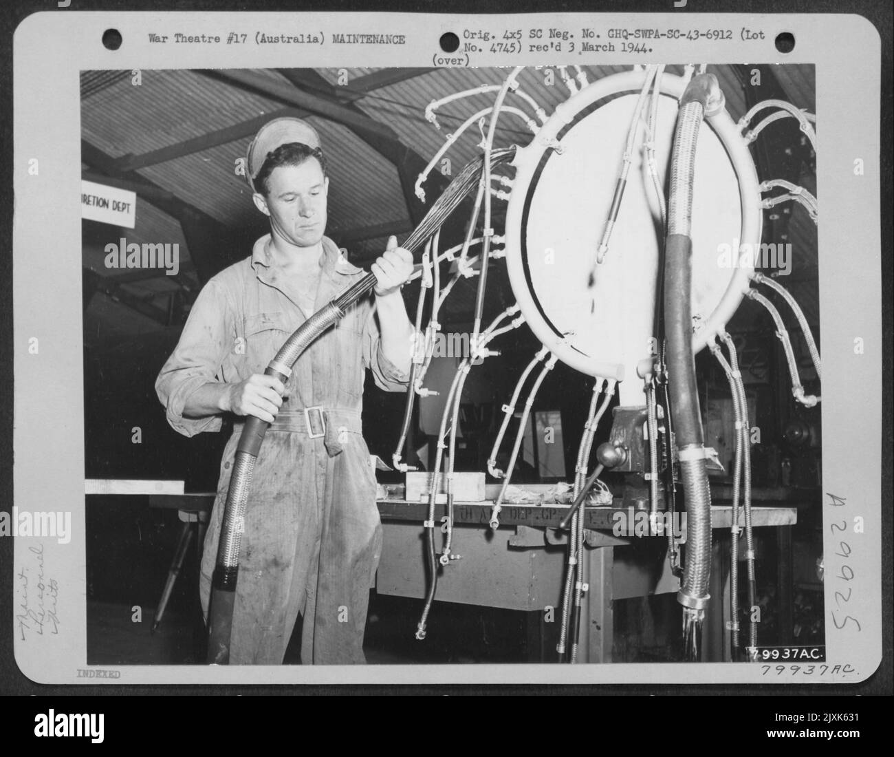 Sgt. Victor P. Witkauskas of Sheboygan, Wisconsin wires up the ignition ...