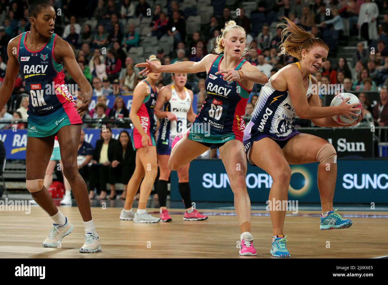 Stephanie Wood of the Lightning takes a pass ahead of Jo Weston of the ...