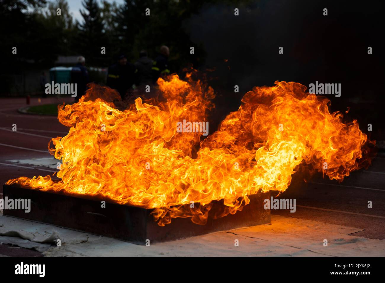 Real hot fire with smoke on the side Stock Photo - Alamy