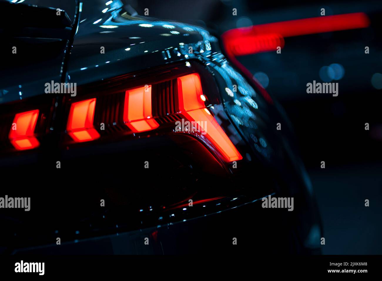 Close-up of LED tail lights and stop light of a car. Contrast image ...