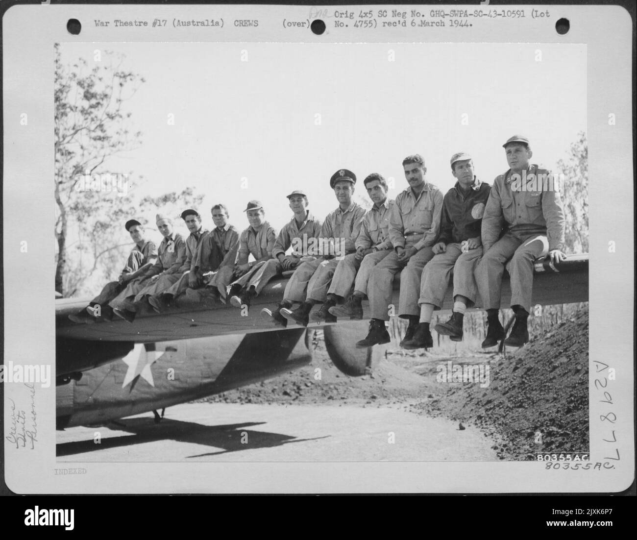 Crew members of a Consolidated B-24 of the 530th Bomb Squadron, 380th ...