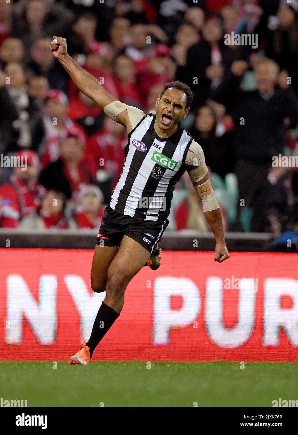 Travis Varcoe of the Magpies celebrates after kicking a goal during the ...