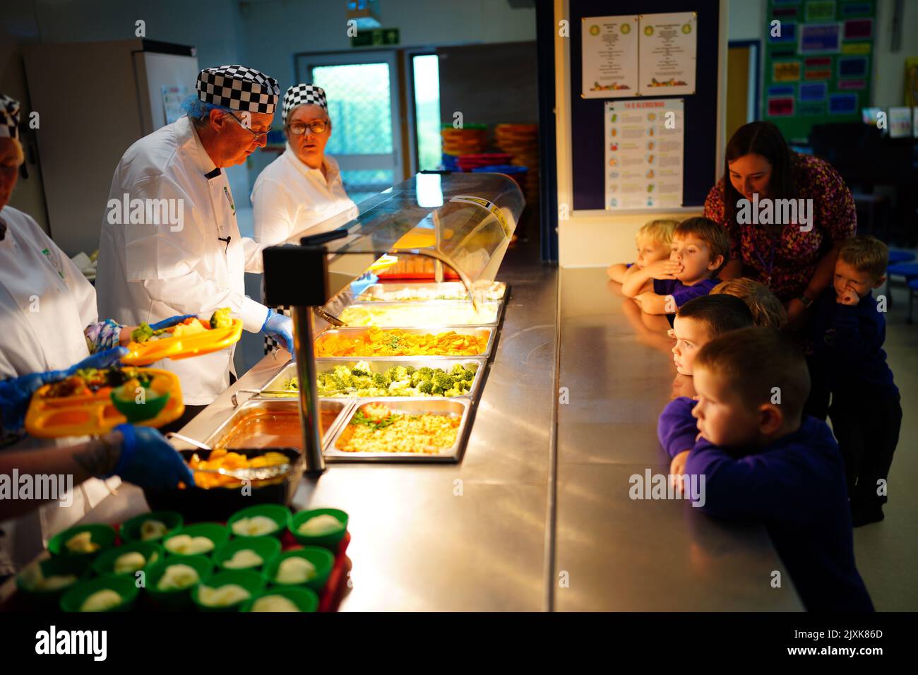 First minister Mark Drakeford serves lunches with the school lunch ...