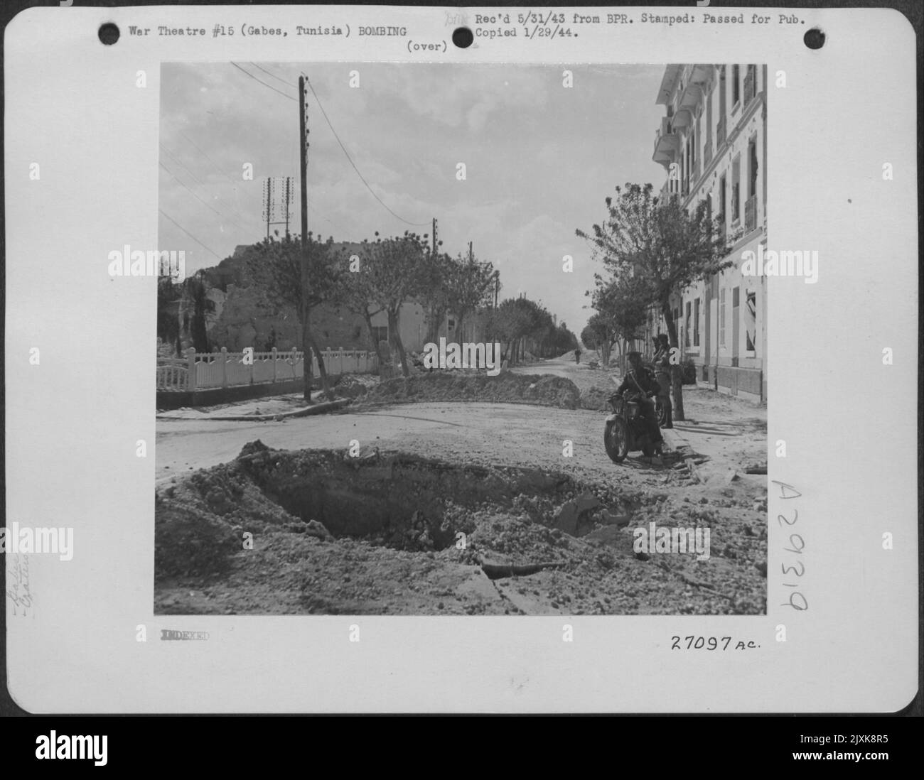 Gabes, Tunisia-Huge bomb craters in the roadway outside the German ...