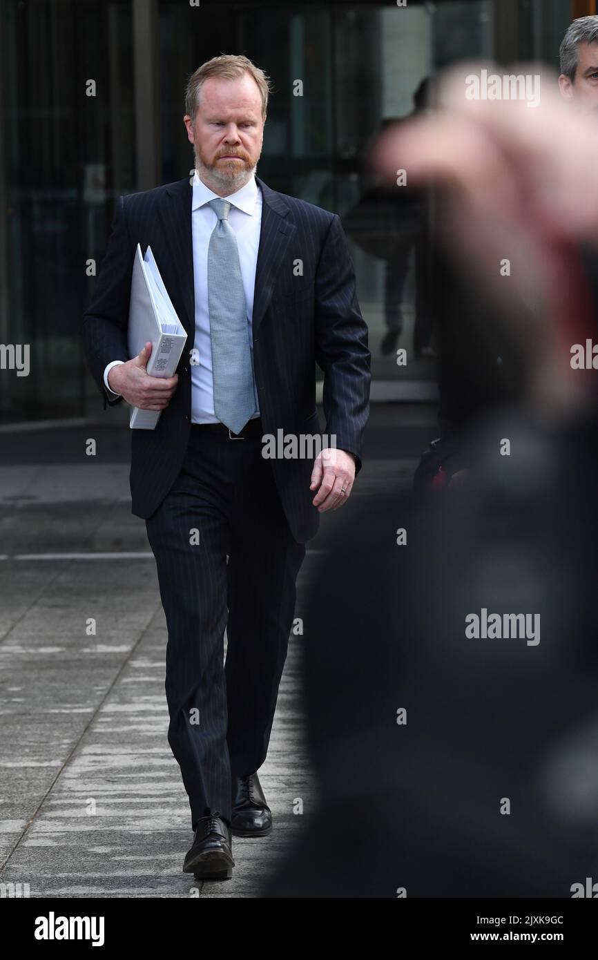 AustralianSuper executive Jason Peasley is seen leaving after giving ...