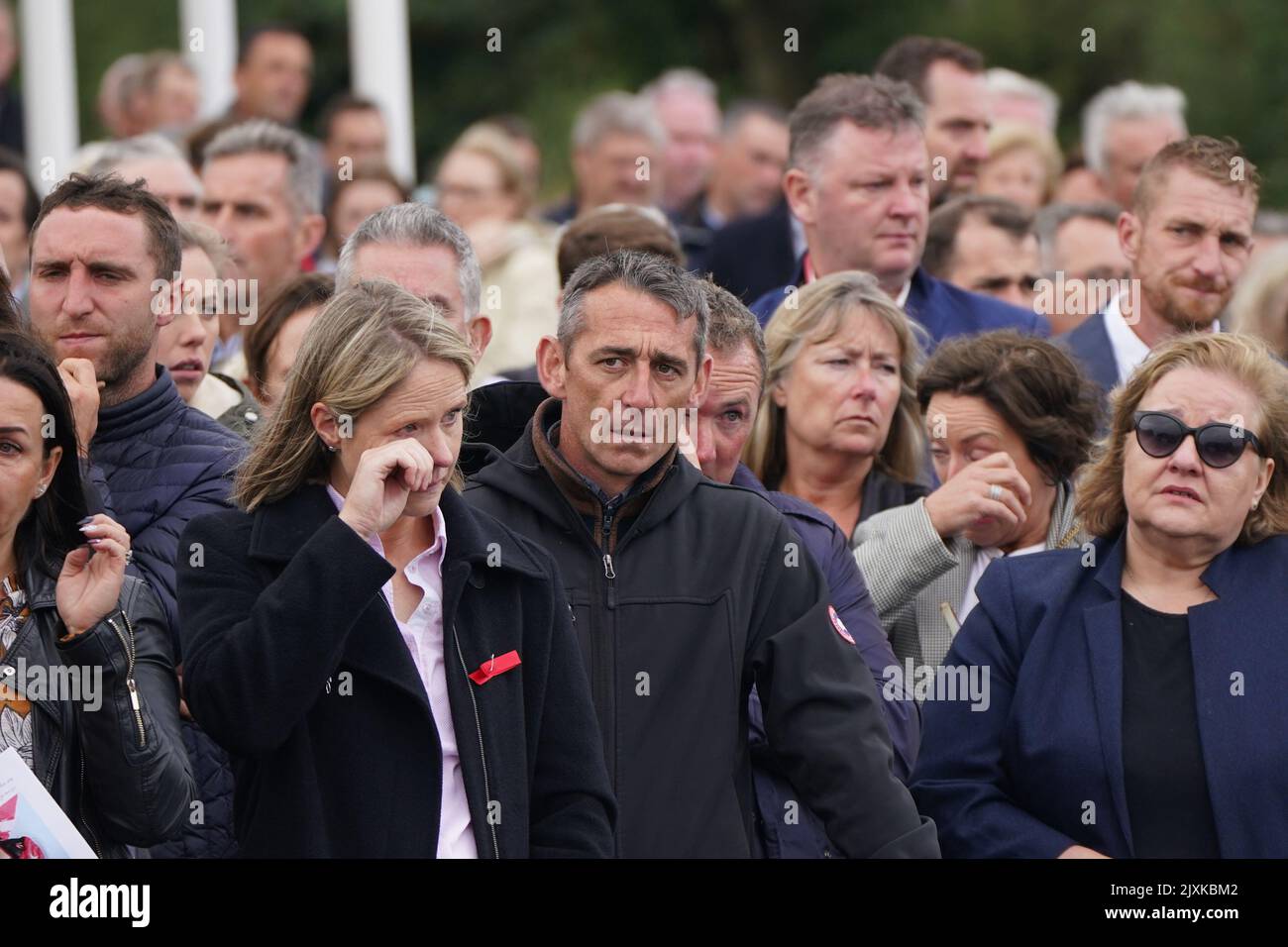 Jockey Davy Russell (right), leaves the church after the funeral ...