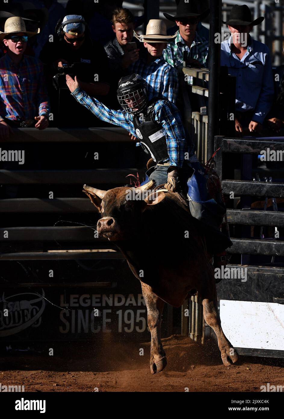 A competitor takes part in the Bull Ride event at the Mount Isa Mines ...