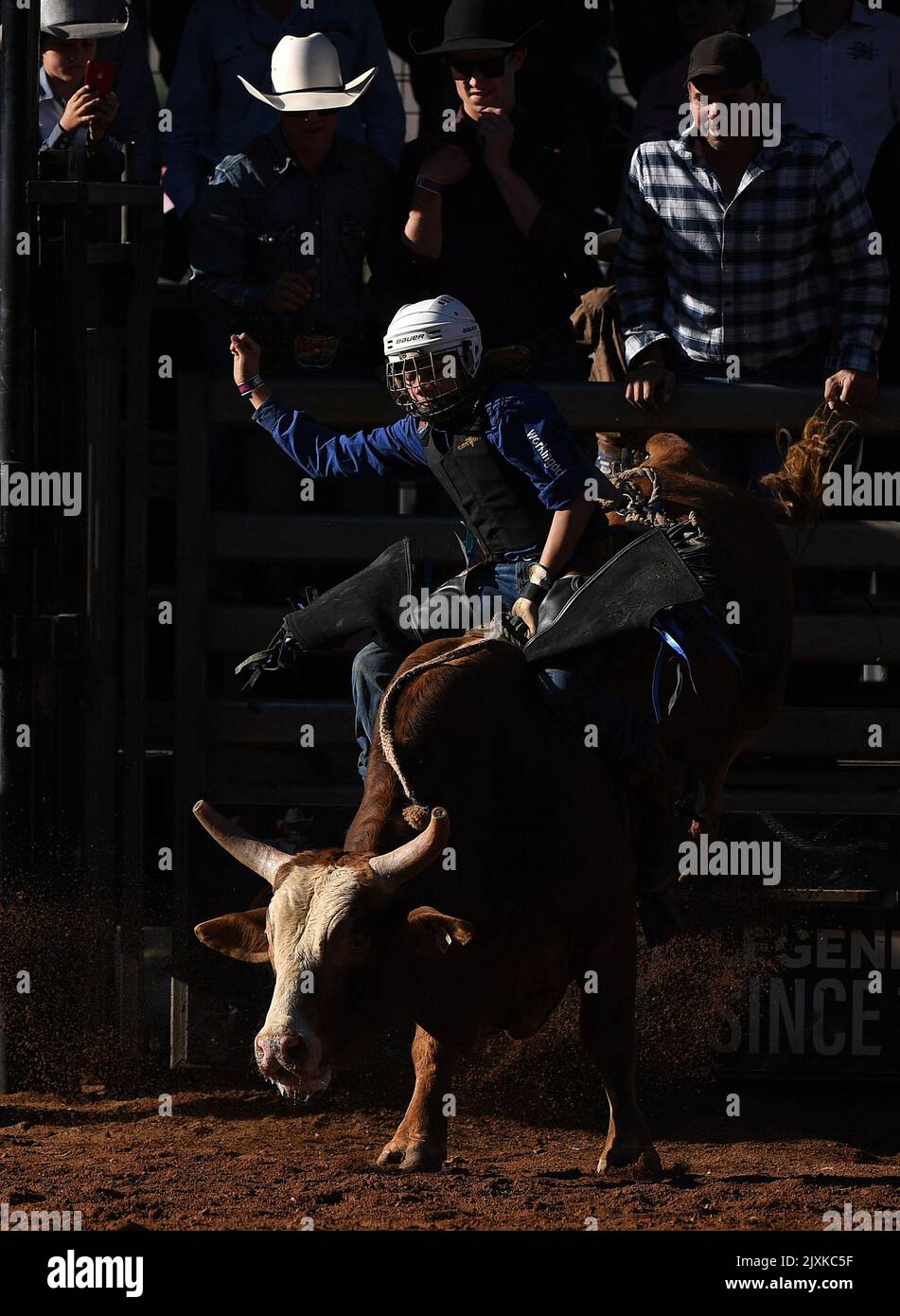 A competitor takes part in the Bull Ride event at the Mount Isa Mines ...