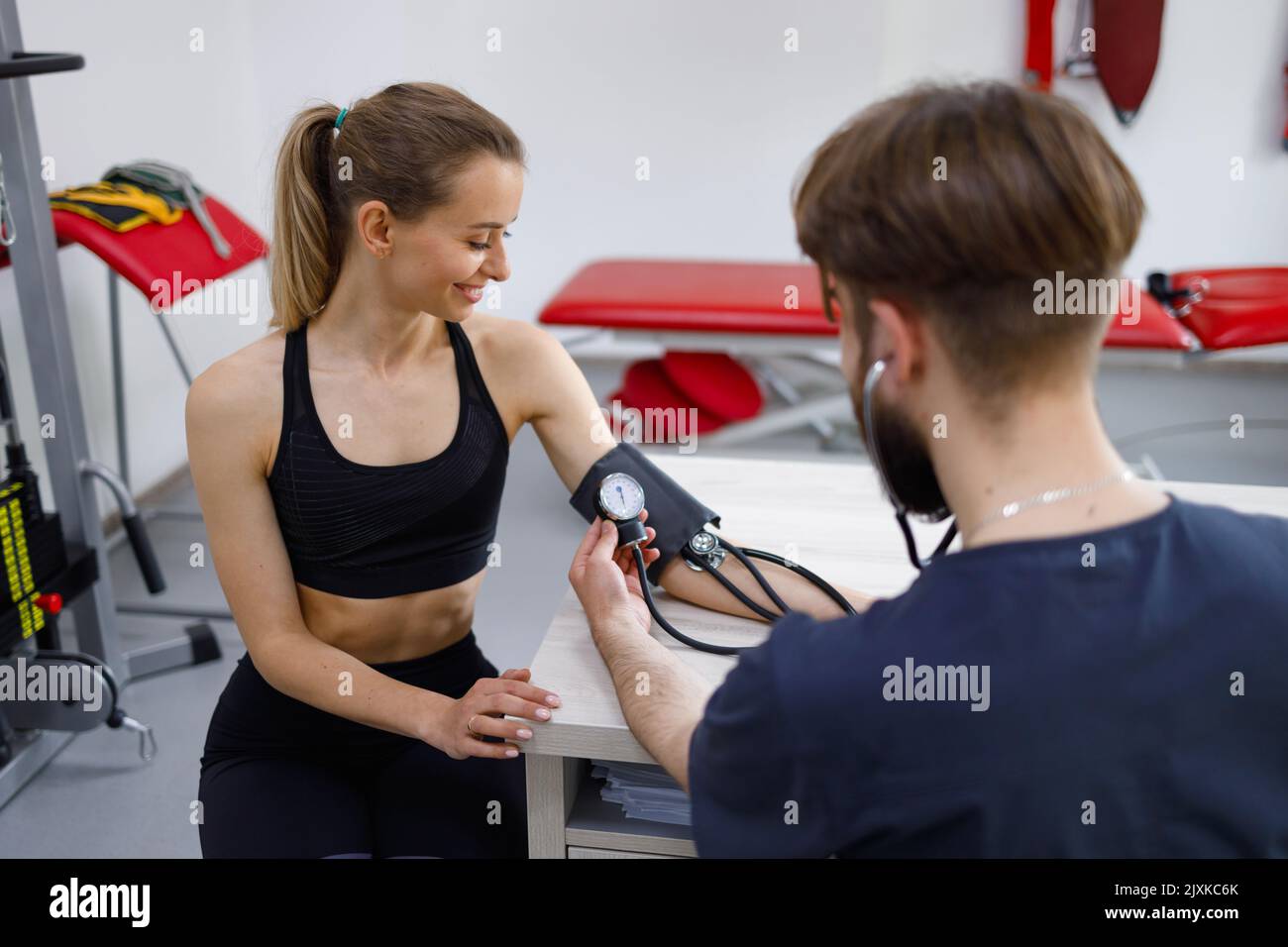 Female athlete undergoes an exercise tolerance test with a cardiologist ... Female athlete undergoes an exercise tolerance test with a cardiologist ...