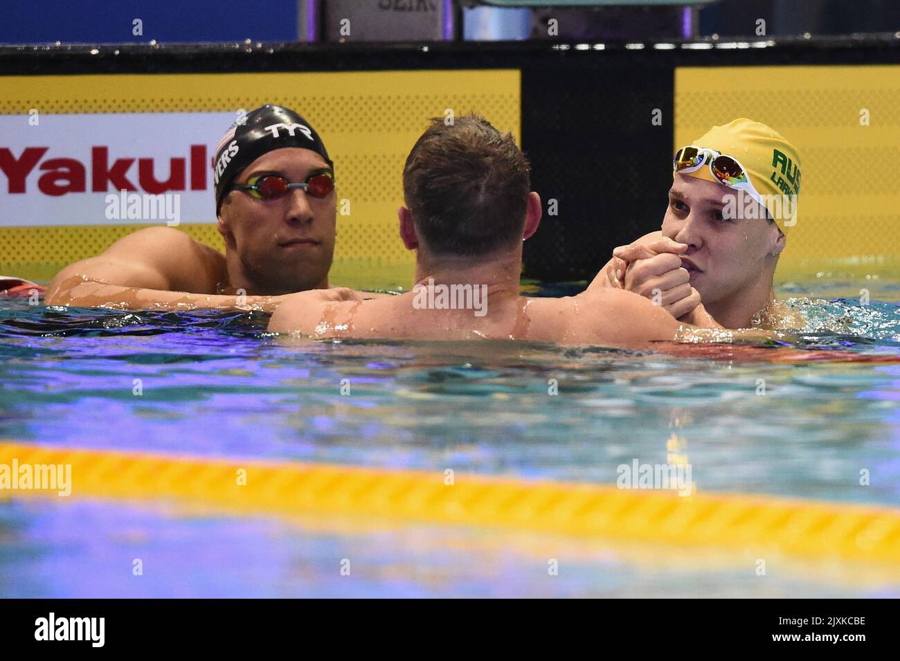 Bronze medalist Mitch Larkin of Australia (right) shakes hands with ...