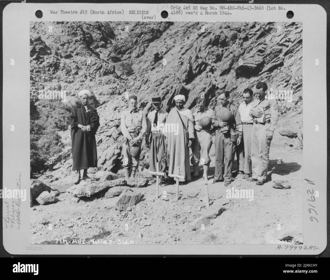 Native and military personnel at the graves of the Air Force bodies in ...