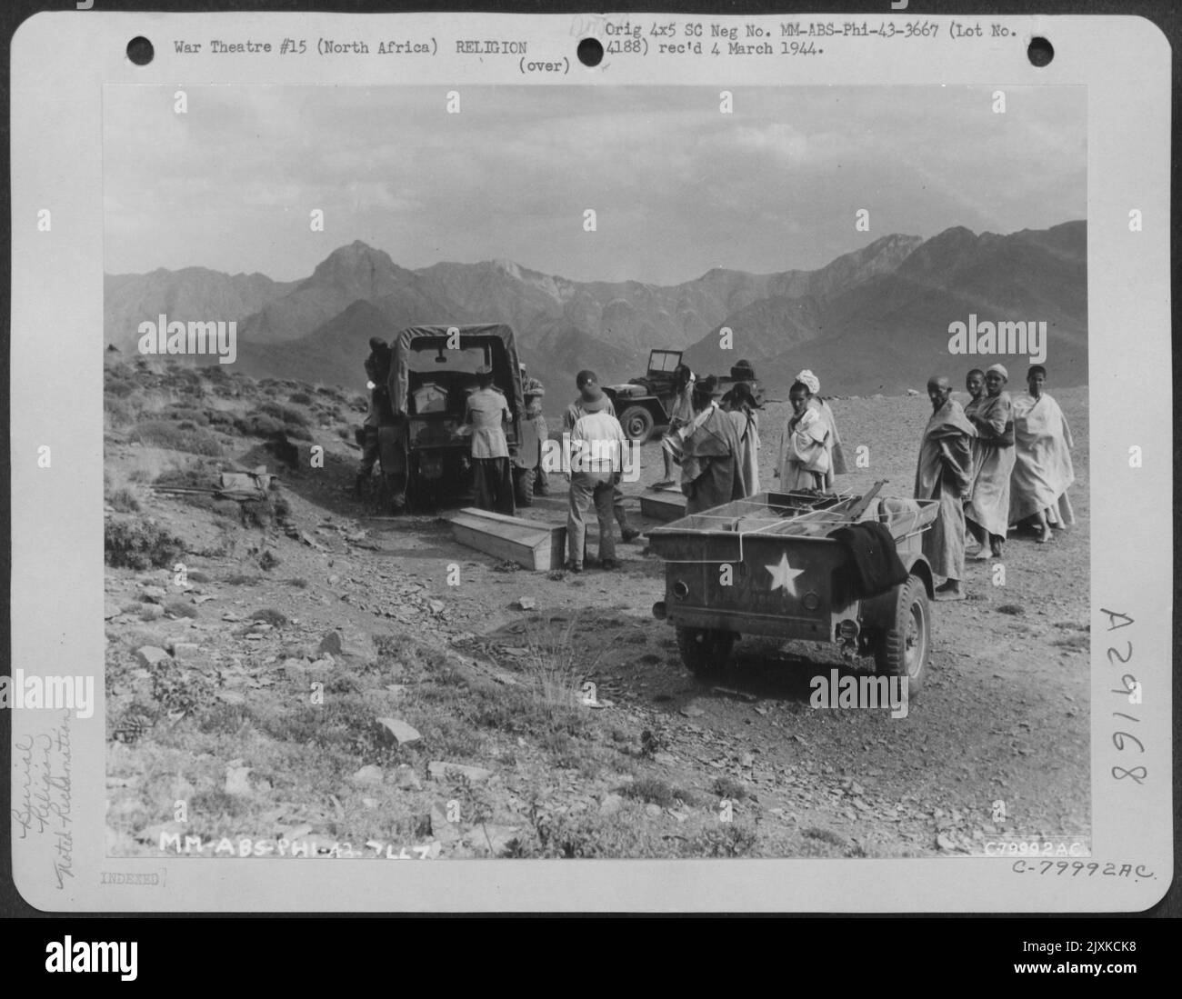 Bodes of the Air Force dead are shown being loaded on a truck for ...
