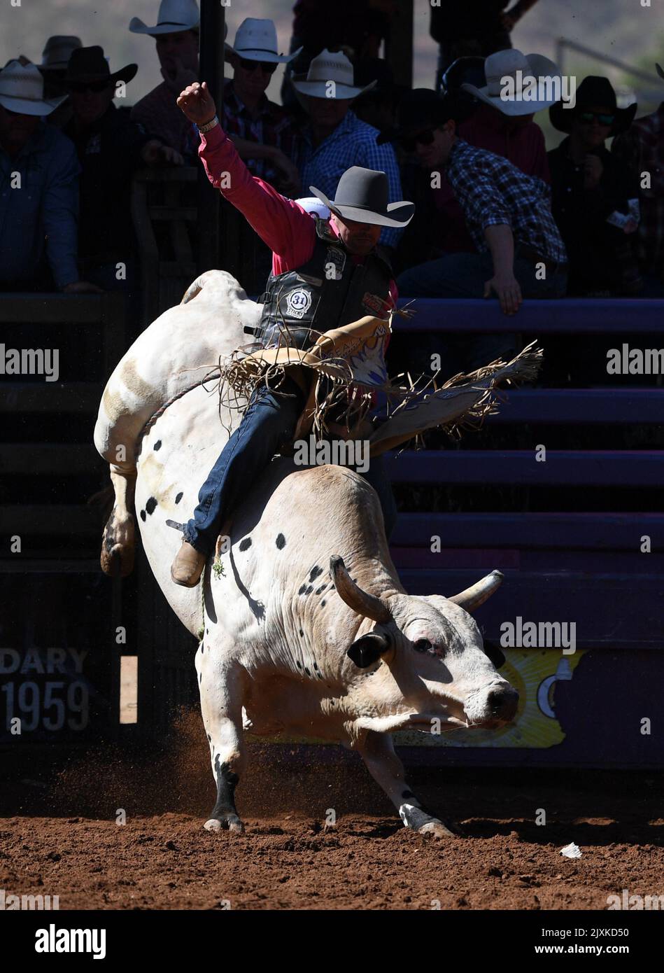 Josh Birks competes in the open bull ride event at the Mount Isa Mines ...