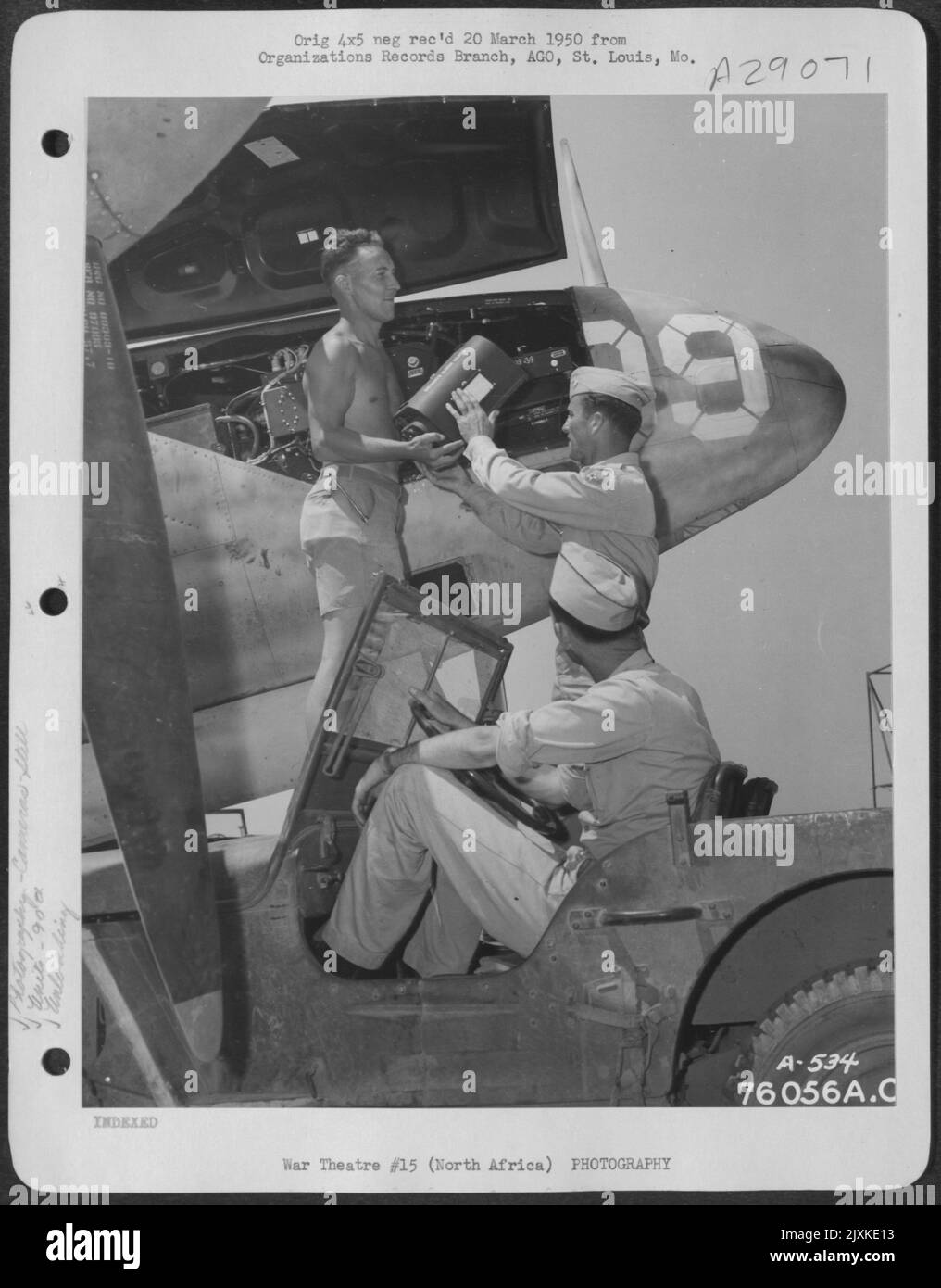 Personnel of the 90th Photographic Reconnaissance Wing unload camer ...