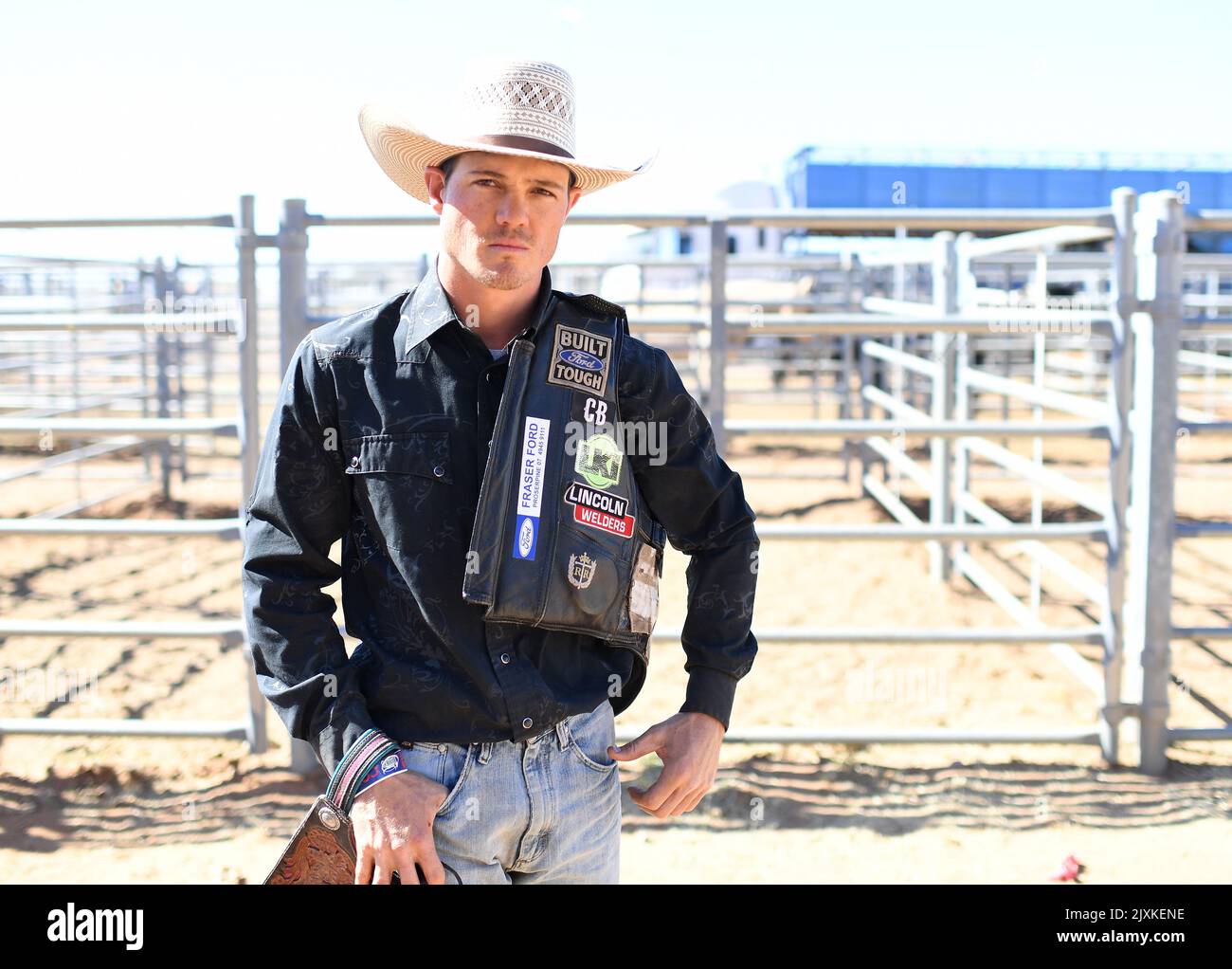 Roy Dunn poses for a photo after riding his bull Blossom to win the ...