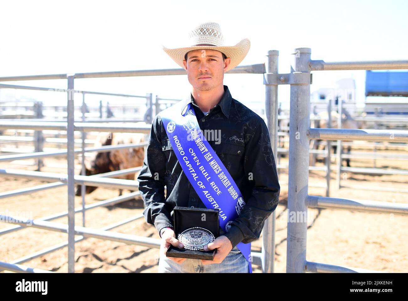 Roy Dunn poses for a photo after riding his bull Blossom to win the ...