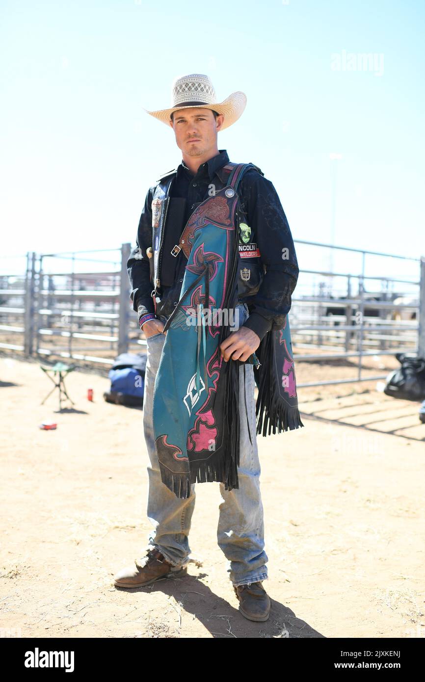 Roy Dunn poses for a photo after riding his bull Blossom to win the ...