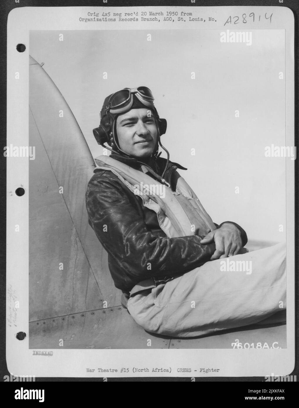 A pilot of the 90th Photographic Reconnaissance Wing poses on his ...