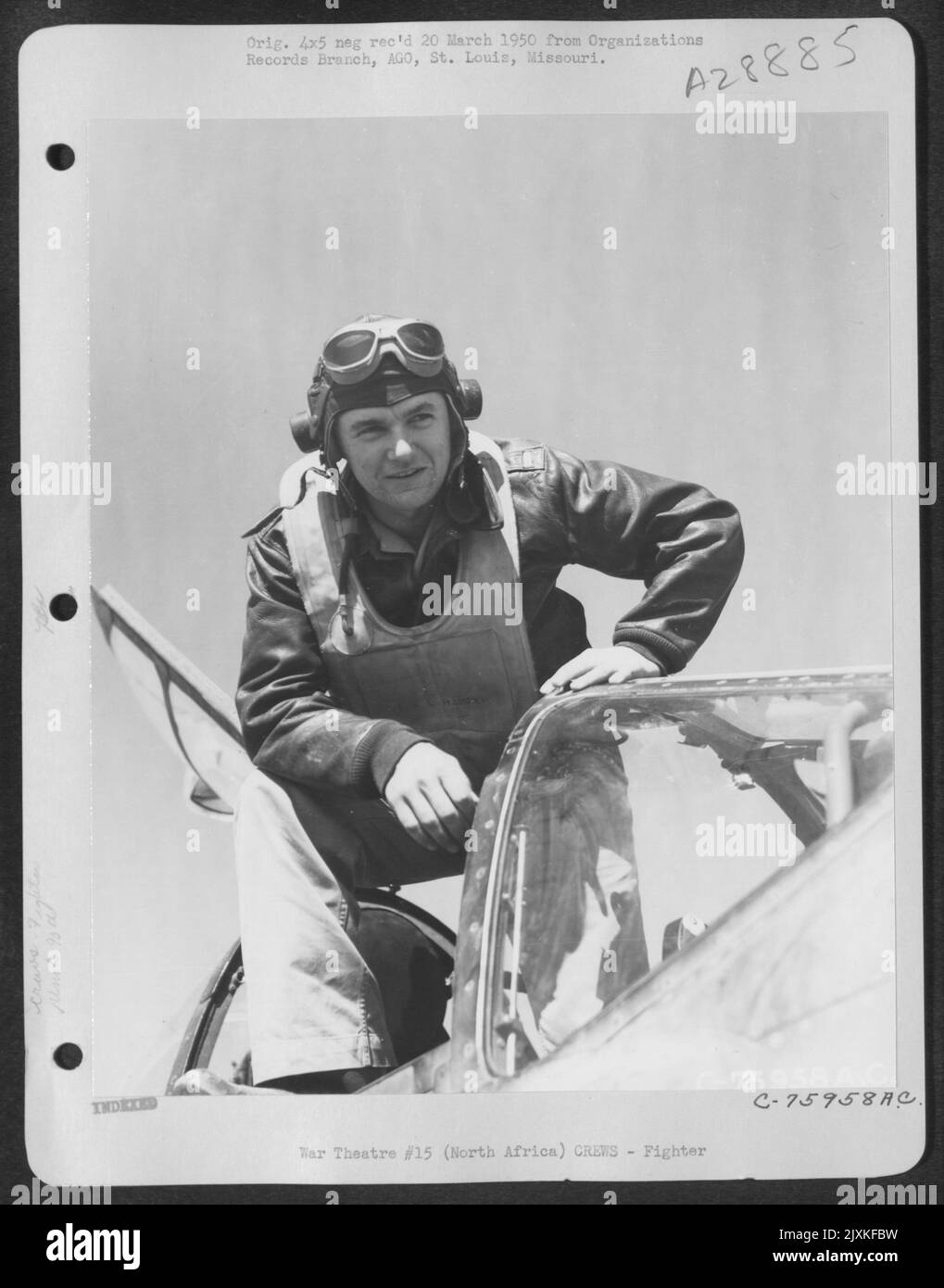 A pilot of the 90th Photographic Reconnaissance Wing, seated in the ...