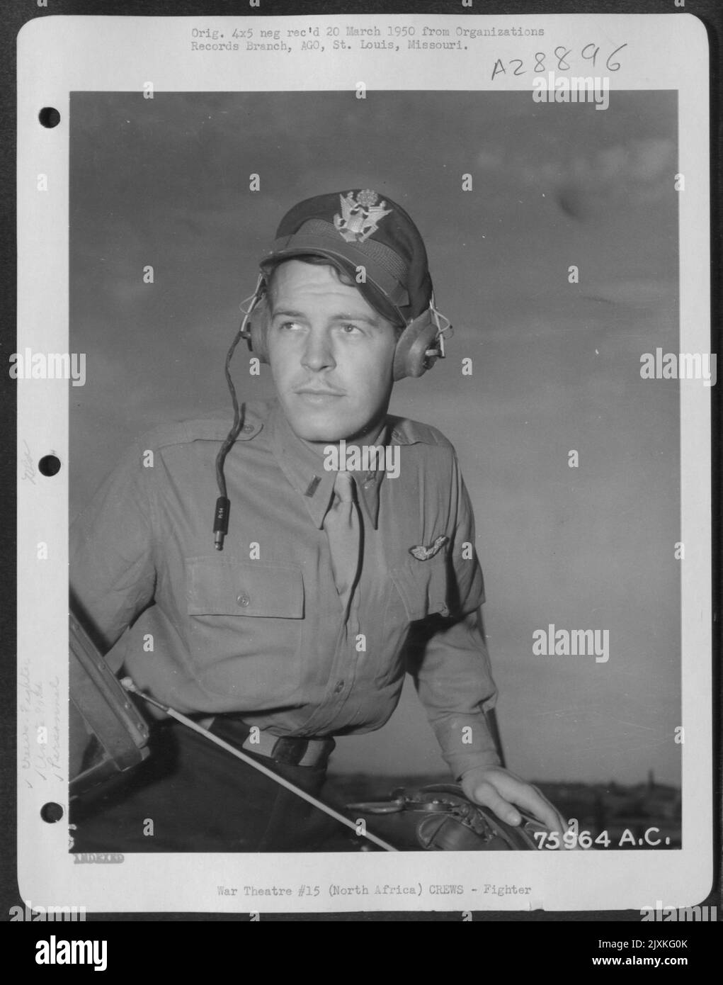 Lt. De Young, pilot of the 90th Photographic Reconnaissance Wing, poses ...
