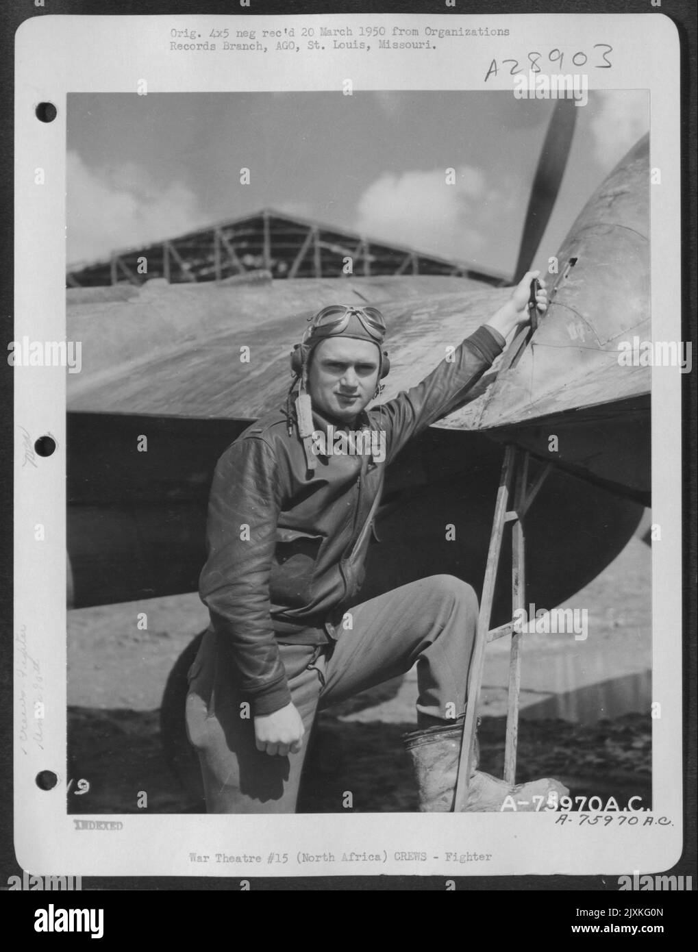 A pilot of the 90th Photographic Reconnaissance Wing, beside his ...