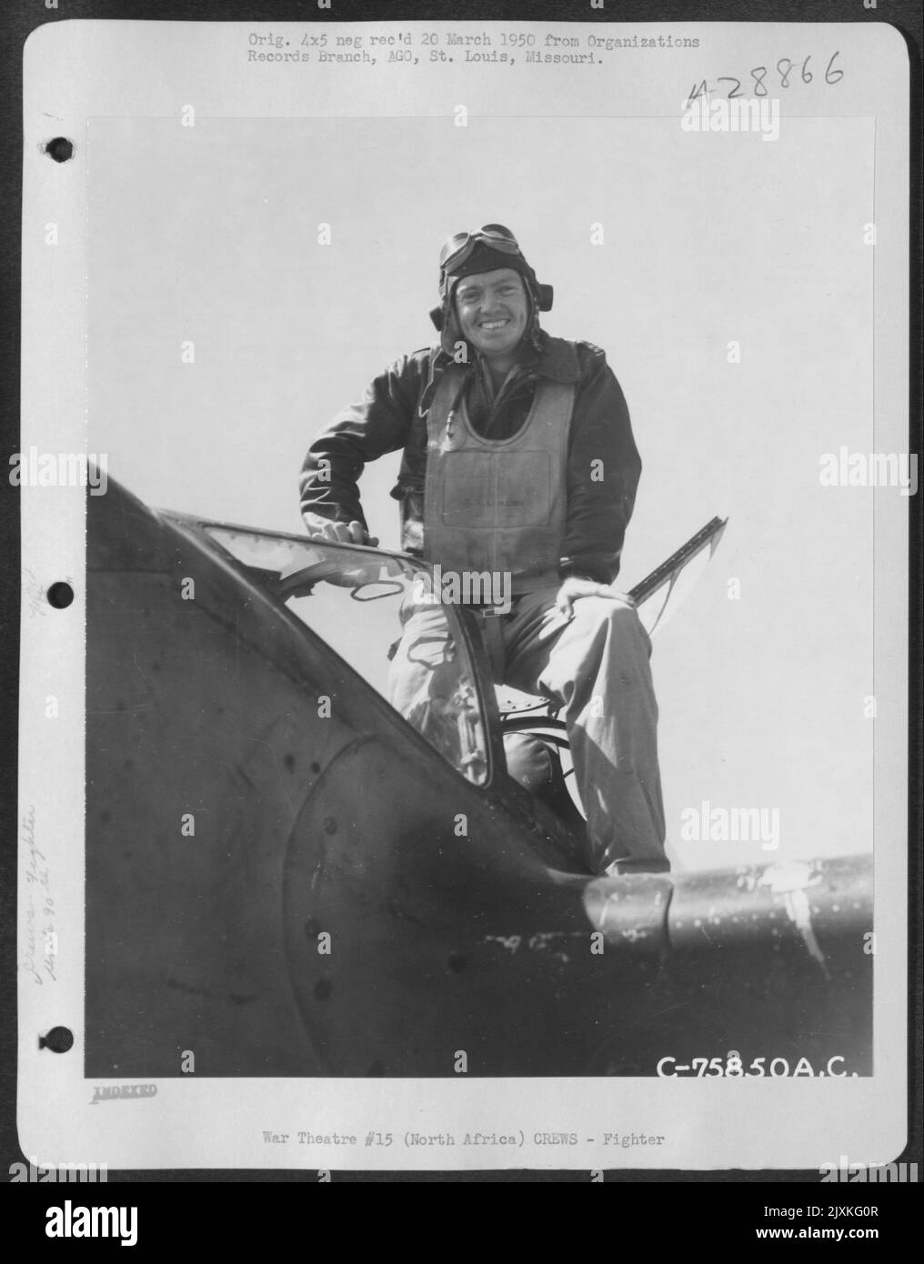 A pilot of the 90th Photographic Reconnaissance Wing, steps into the ...