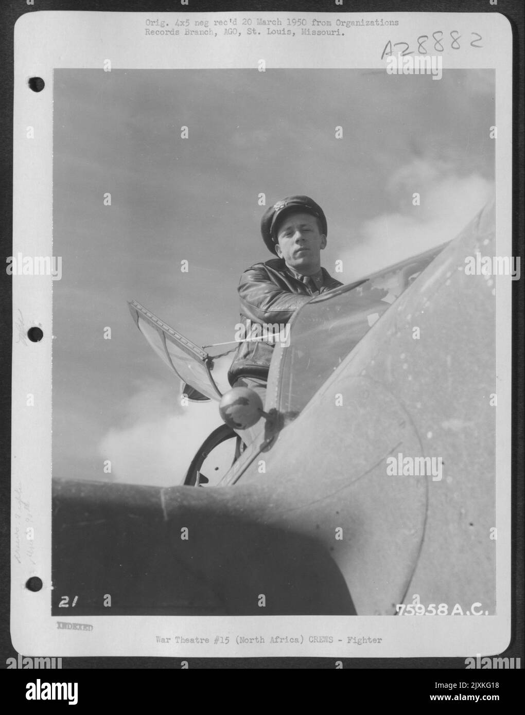 A pilot of the 90th Photographic Reconnaissance Wing, seated in the ...