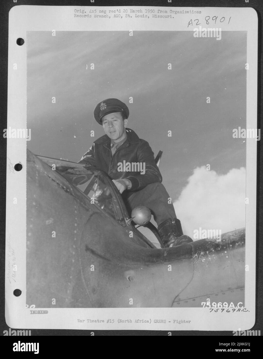 A pilot of the 90th Photographic Reconnaissance Wing, poses in the ...