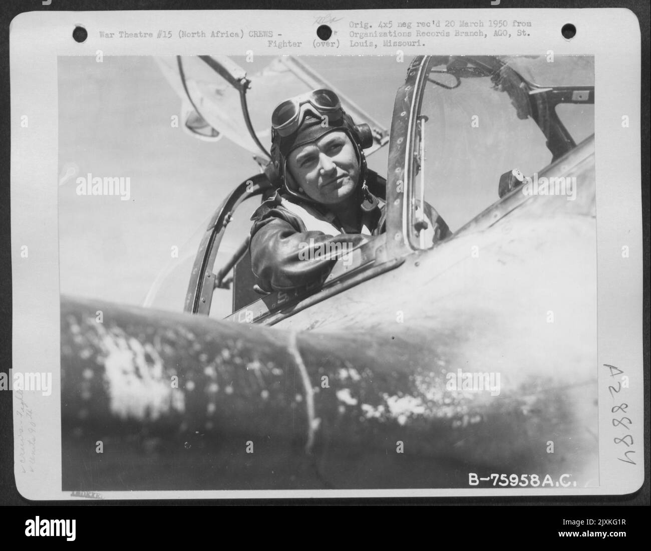 A pilot of the 90th Photographic Reconnaissance Wing, seated in the ...